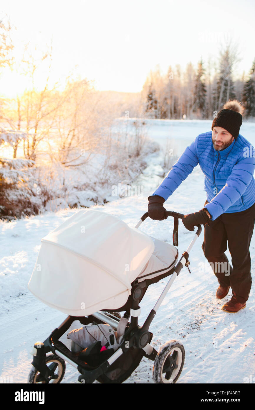 Man walking with buggy Stock Photo - Alamy