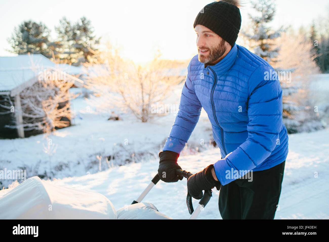 Man walking with buggy Stock Photo - Alamy