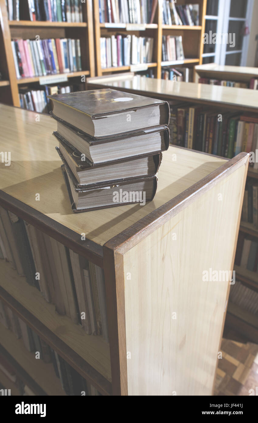 Old books in a vintage library Stock Photo - Alamy