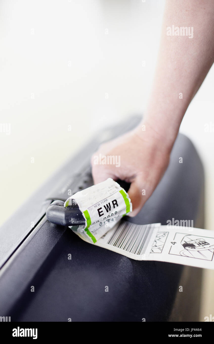 Close-up of mans hand holding suitcase Stock Photo - Alamy