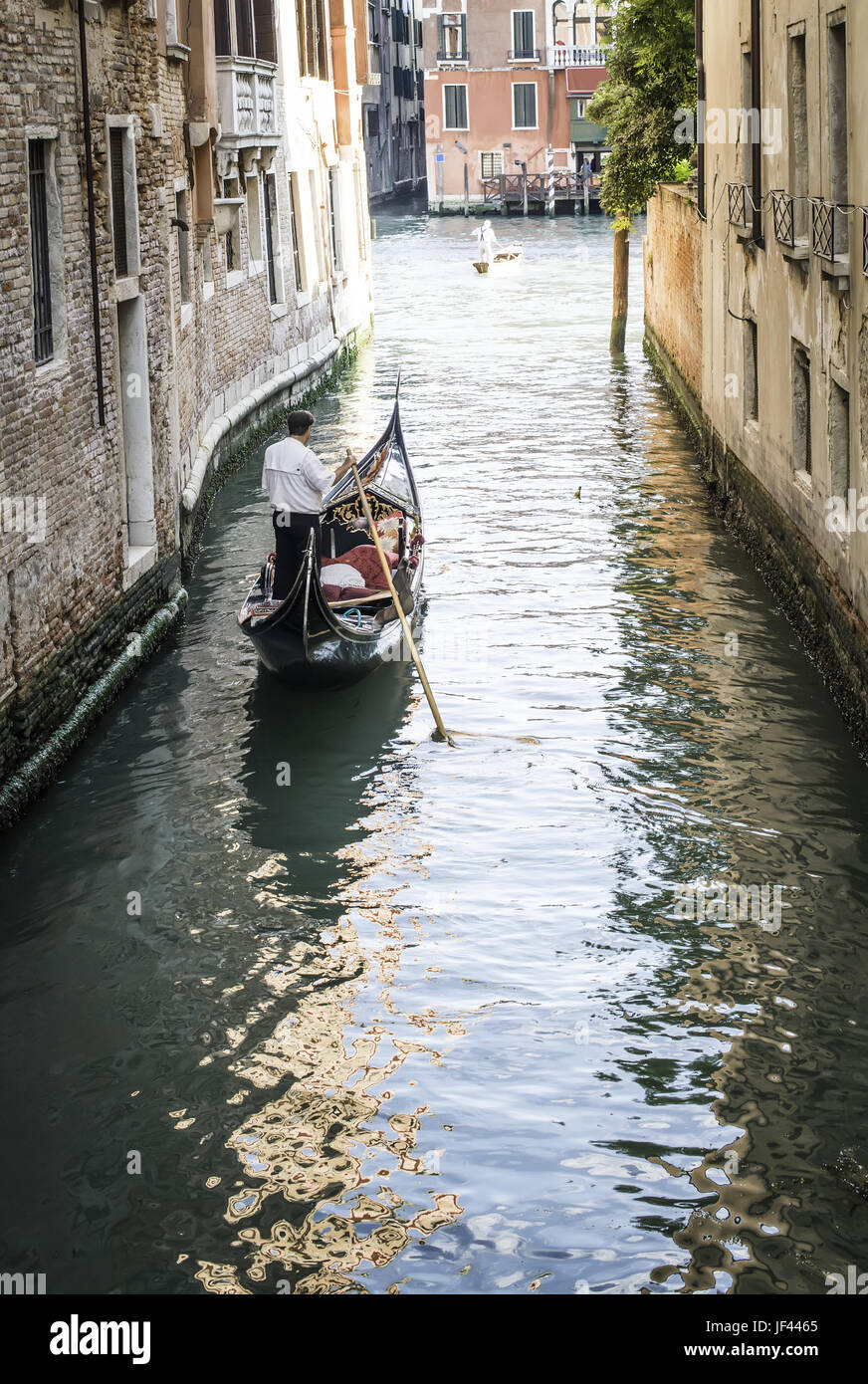 Man on a boat in Venice Stock Photo - Alamy