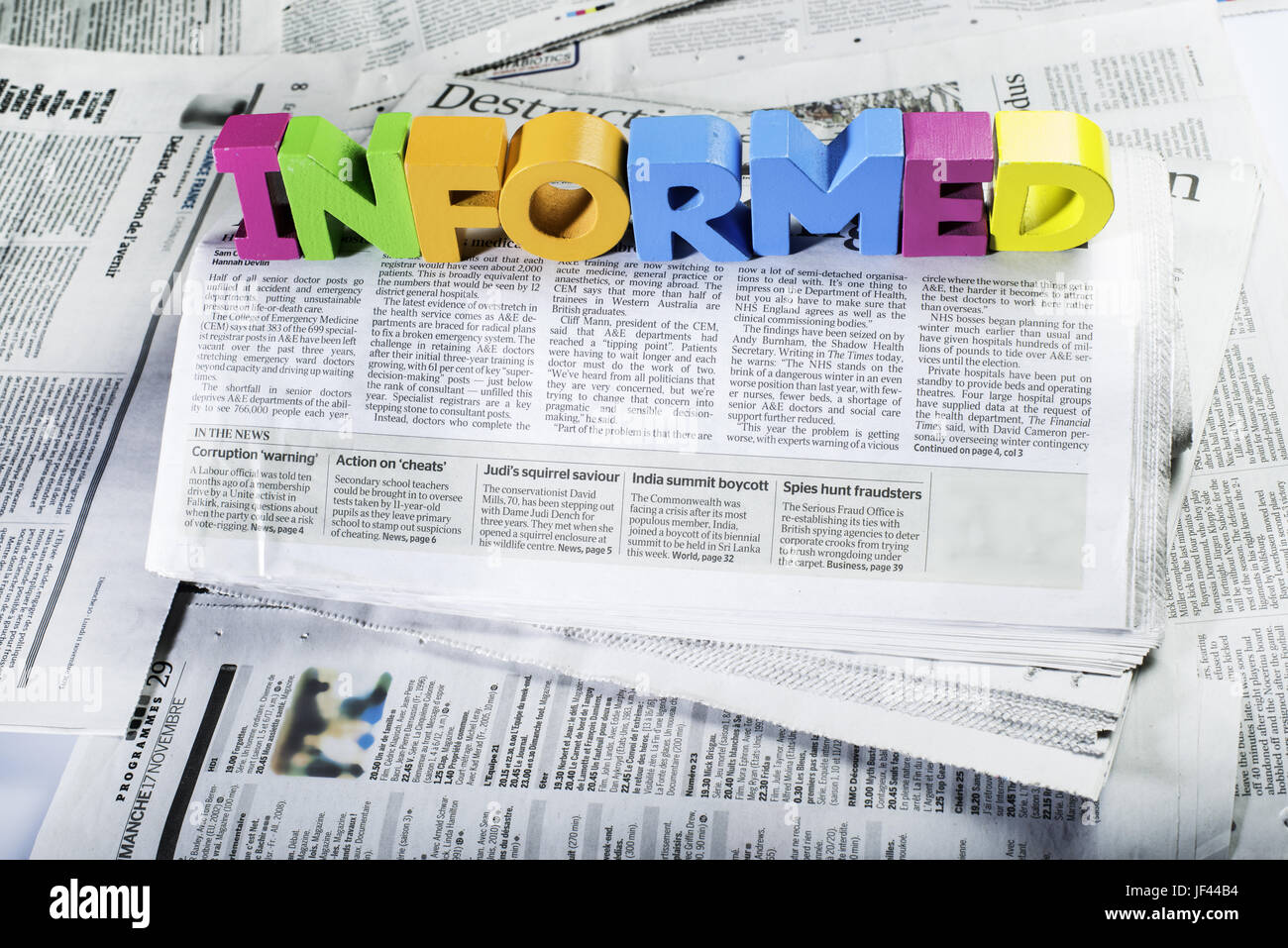 Word informed on newspaper Stock Photo - Alamy