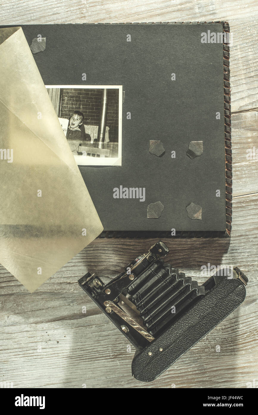 Vintage photo camera and album Stock Photo - Alamy