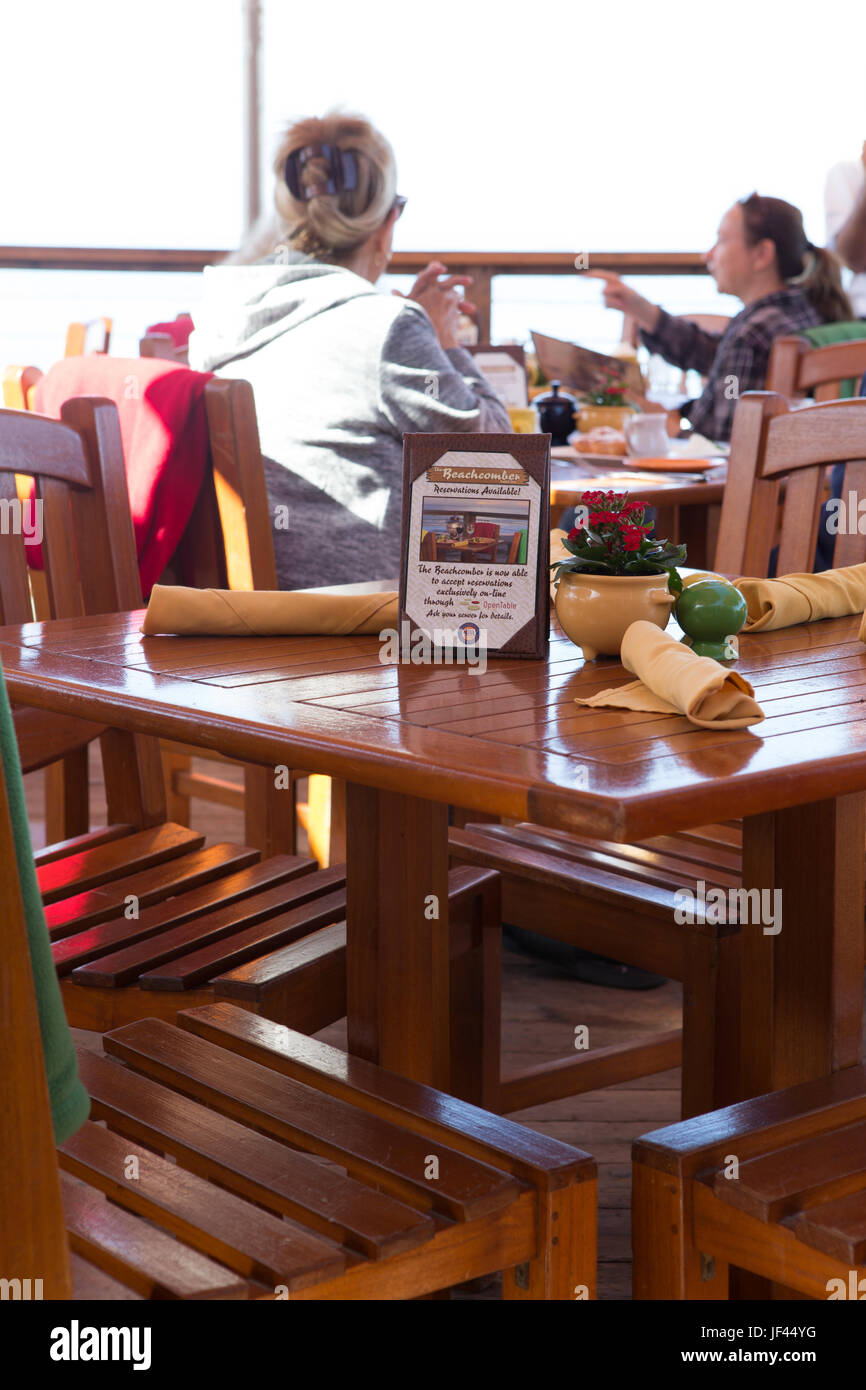 Diners eating outdoors at The Beachcomber Restaurant at Crystal Cove ...