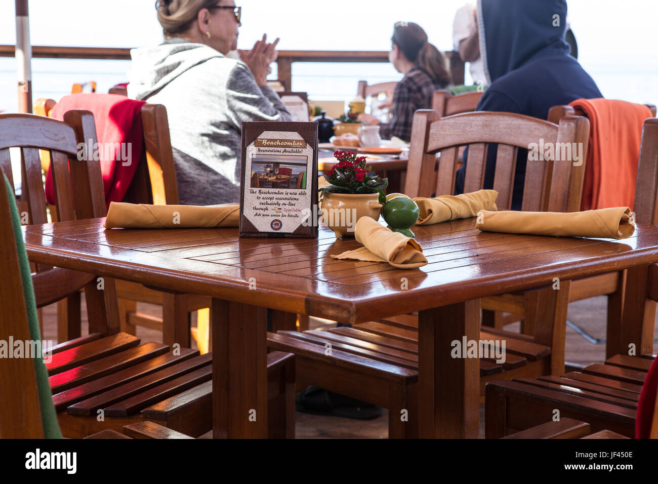 Diners eating outdoors at The Beachcomber Restaurant at Crystal Cove ...