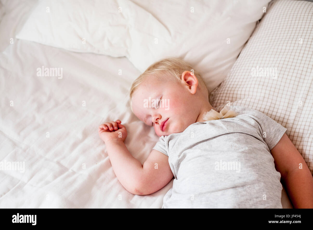 Small boy slipping in bed Stock Photo - Alamy