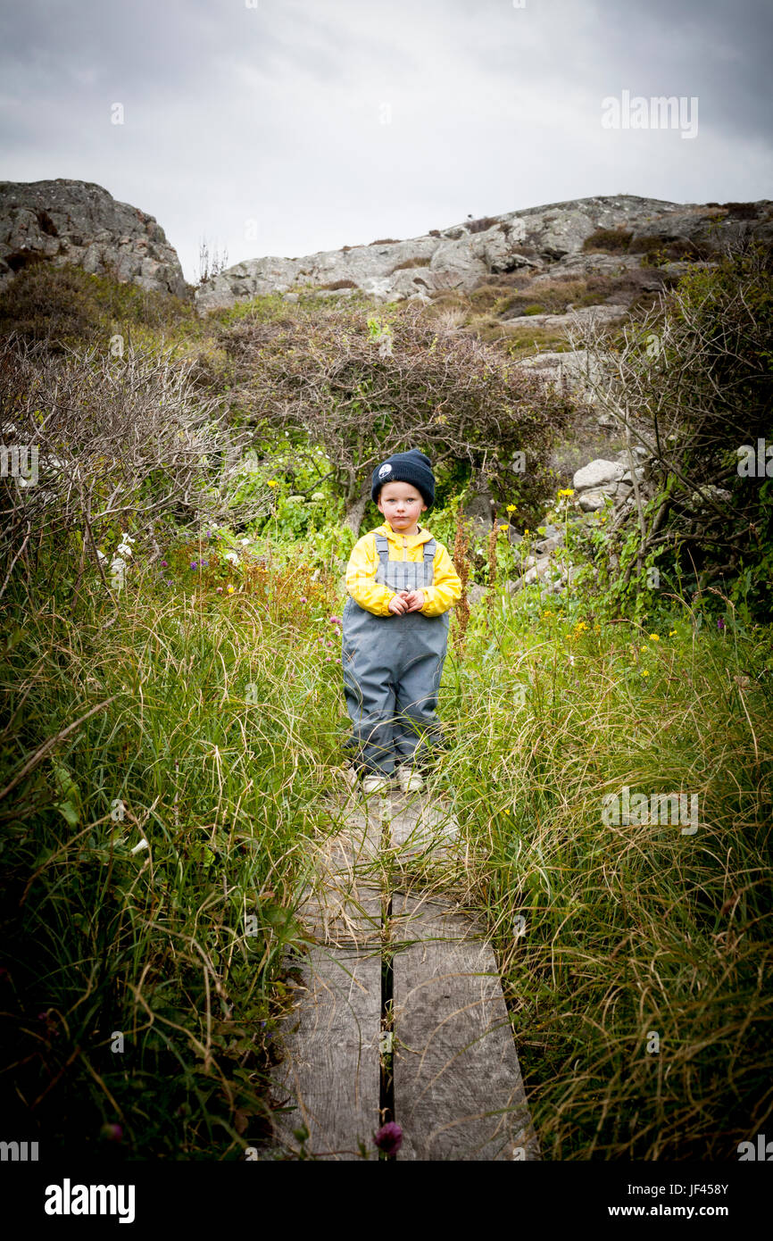 Small boy standing hi-res stock photography and images - Alamy
