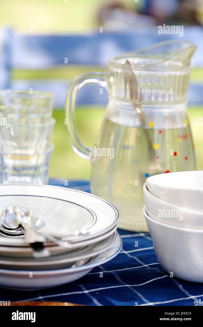 Bowls and jug on table Stock Photo - Alamy