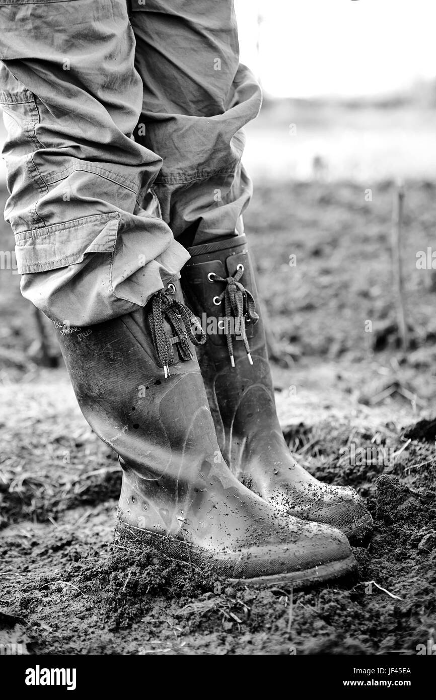 Boots in garden Black and White Stock Photos & Images - Alamy