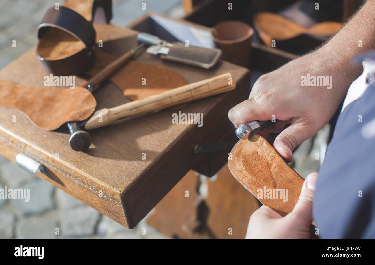 Hands making shoes Stock Photo - Alamy