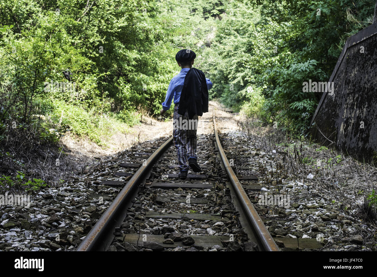 Child walking on railway Stock Photo - Alamy