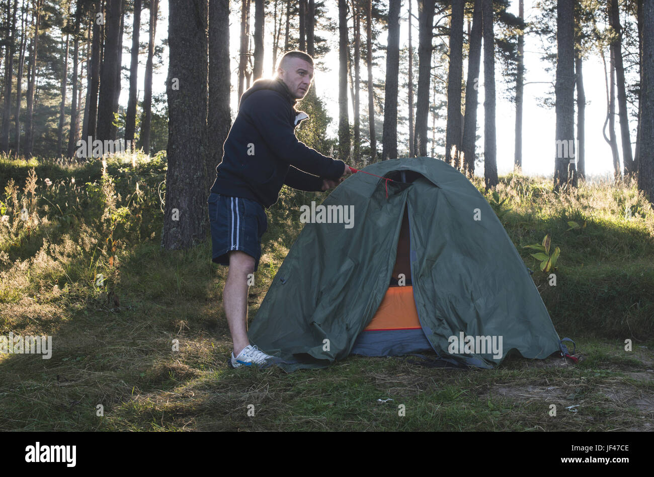Man fix tent hi-res stock photography and images - Alamy