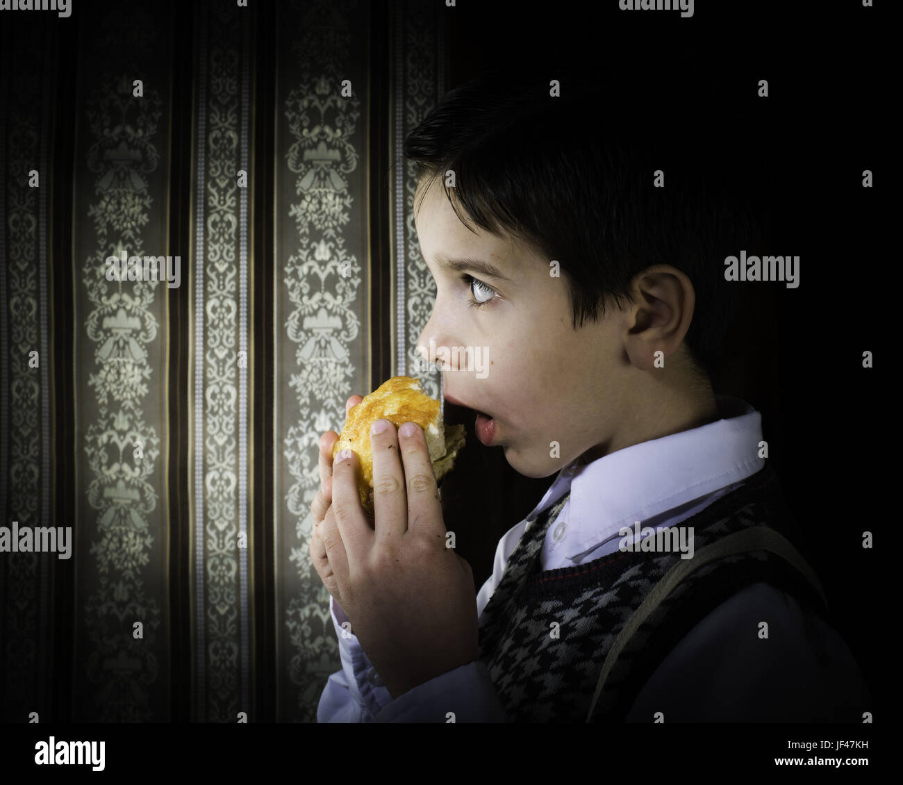 Child who eat. Vintage clothes Stock Photo - Alamy
