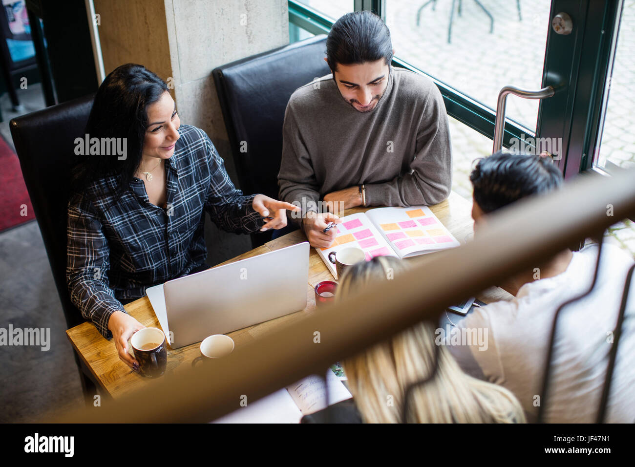 Young people in cafe Stock Photo - Alamy