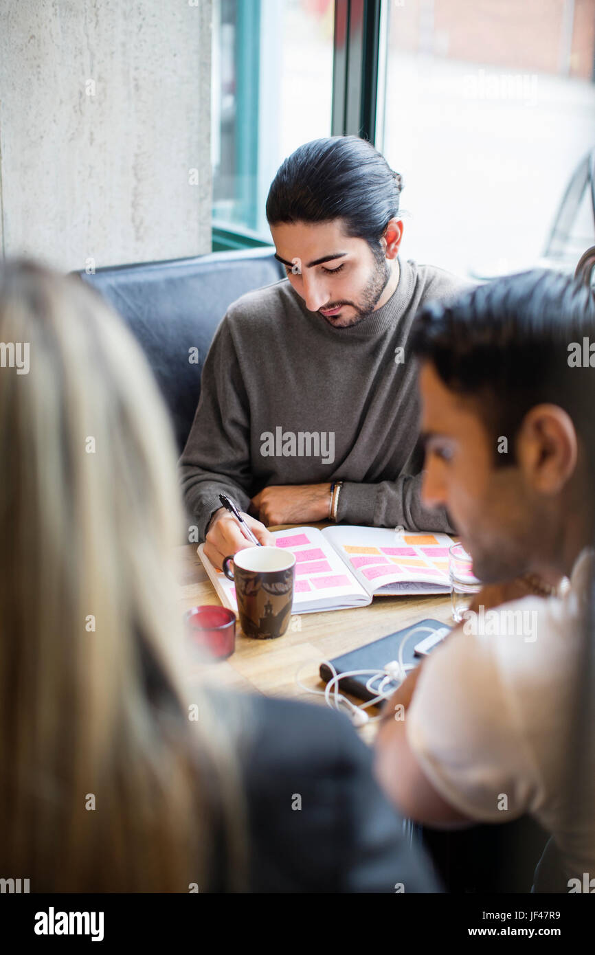 Young people in cafe Stock Photo - Alamy