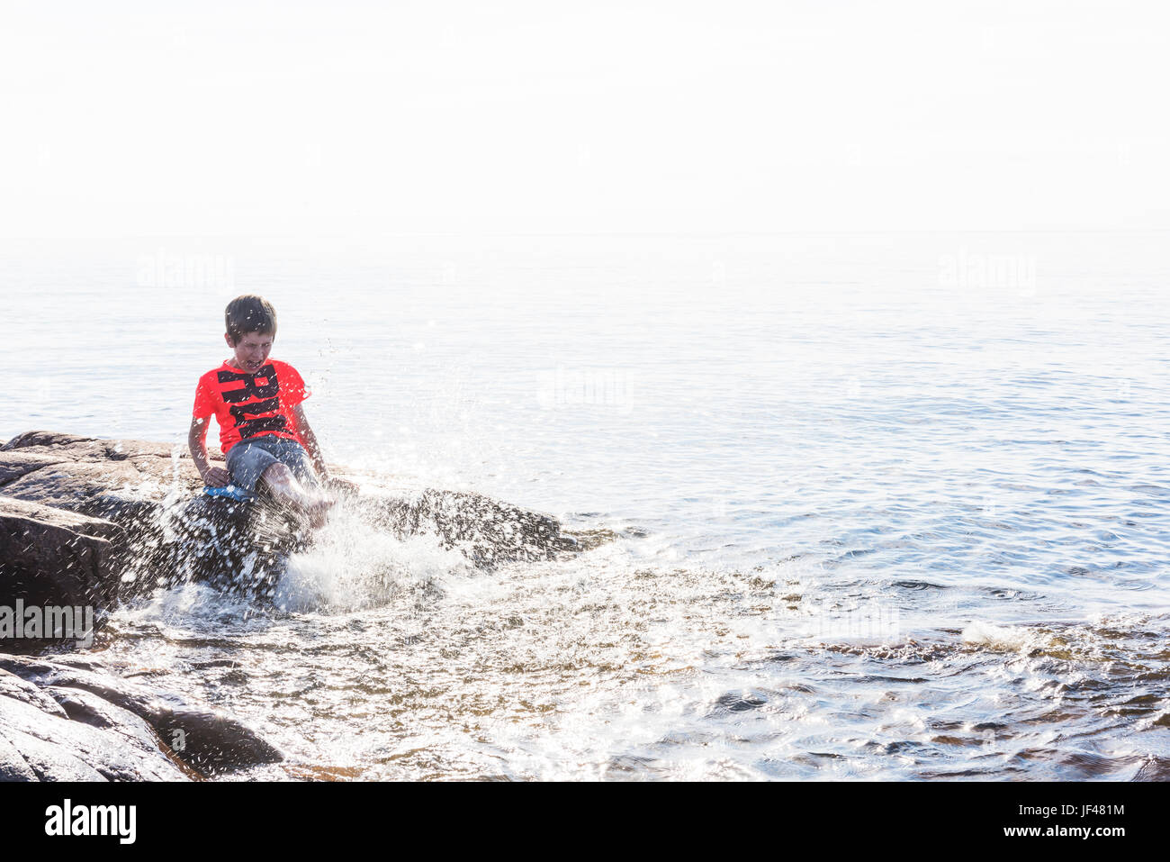 Boy at sea Stock Photo - Alamy
