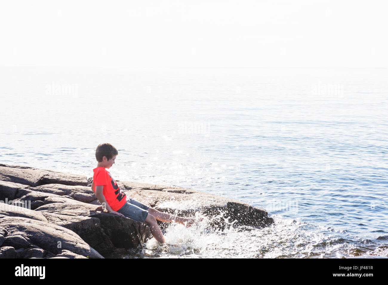Boy at sea Stock Photo - Alamy