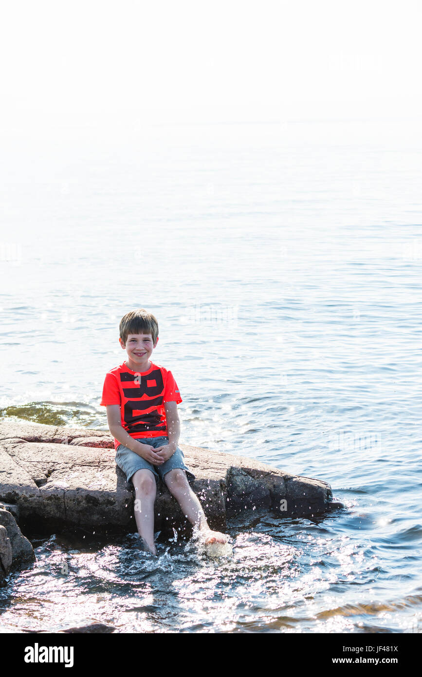 Boy at sea Stock Photo - Alamy