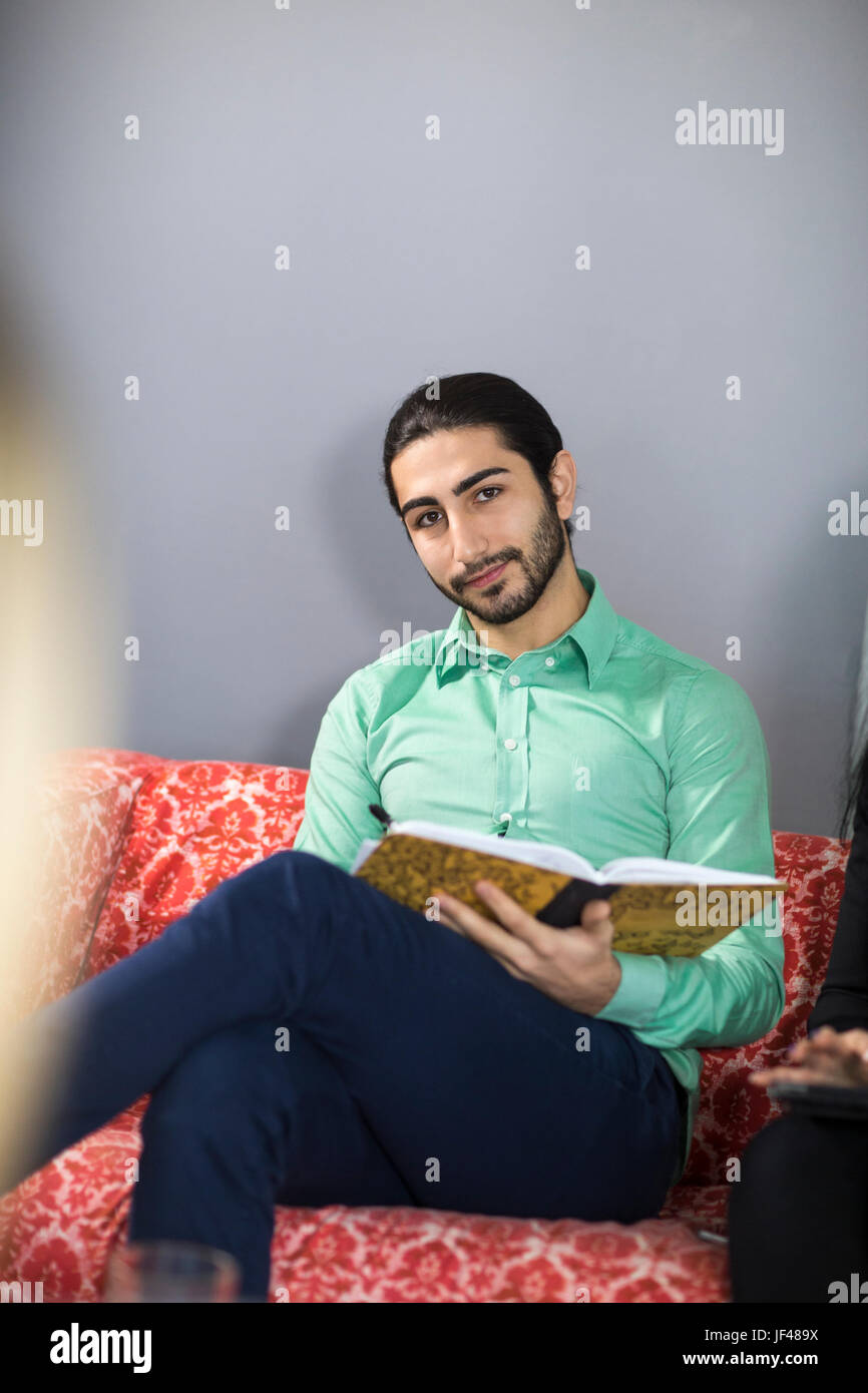 Young man with notebook Stock Photo - Alamy