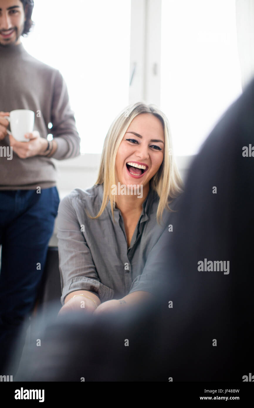 Laughing woman looking at camera Stock Photo - Alamy