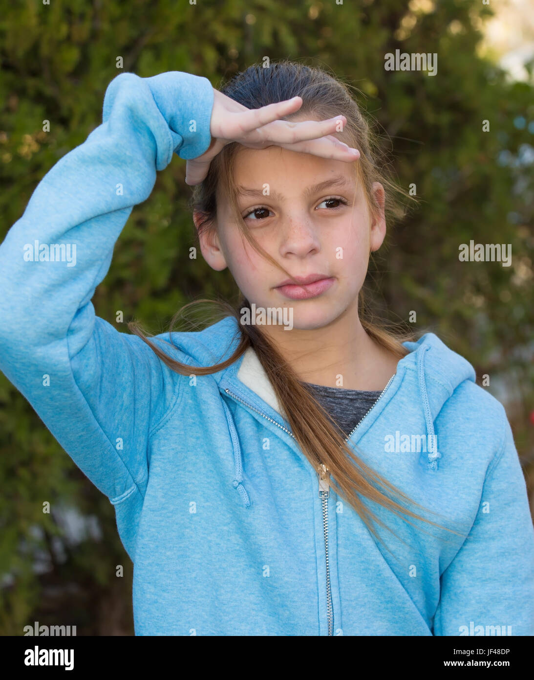 The teenage girl looking into distance Stock Photo - Alamy