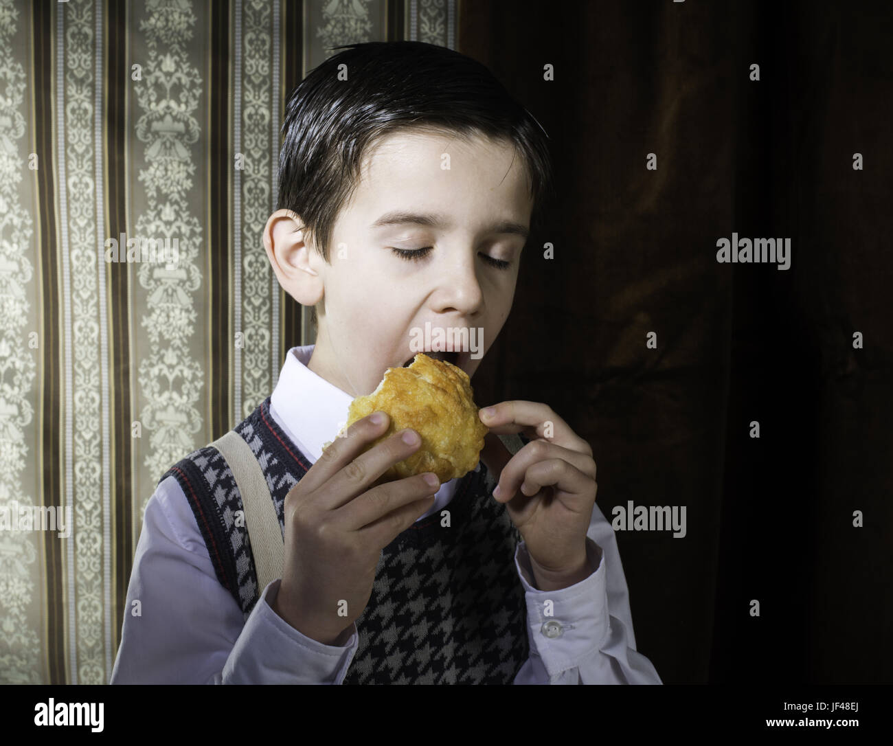 Child who eat. Vintage clothes Stock Photo - Alamy