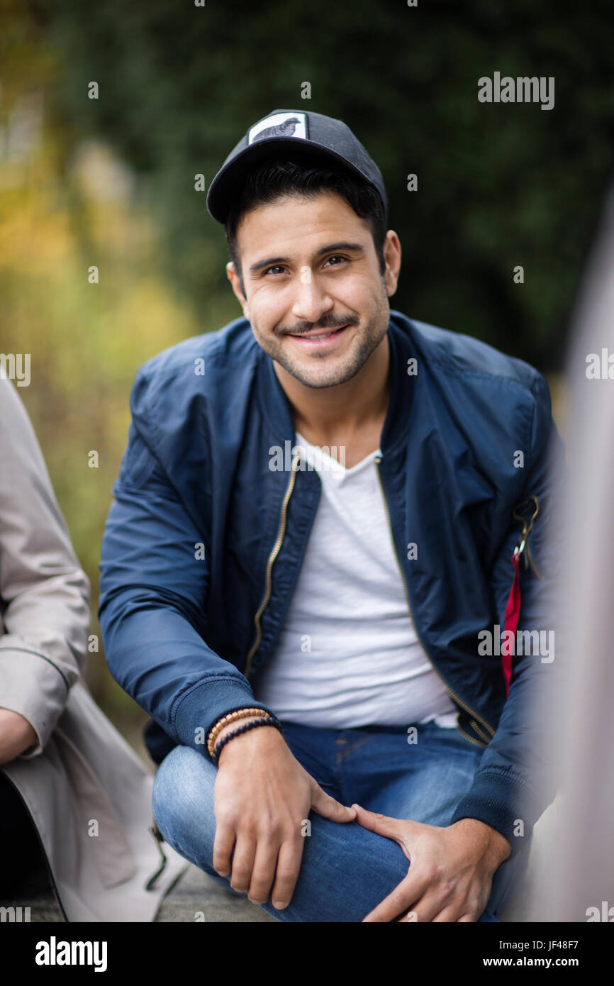 Young man looking at camera Stock Photo - Alamy