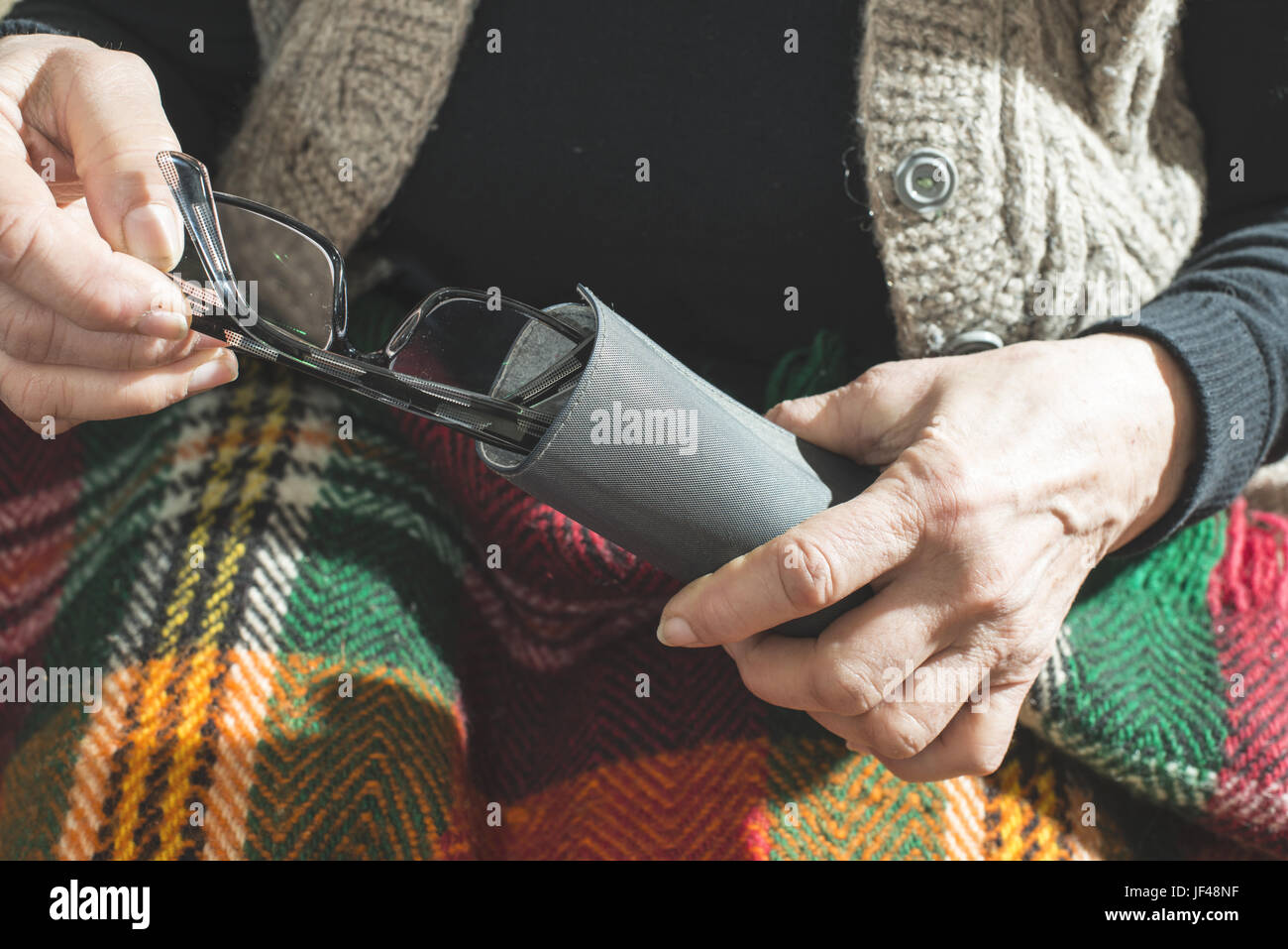 Old women hold glasses Stock Photo - Alamy