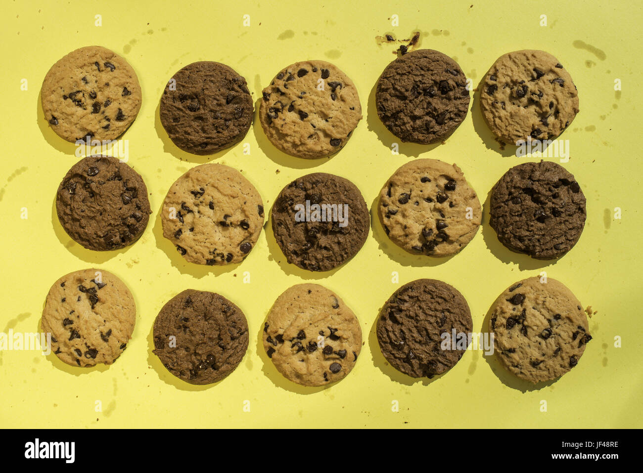 Biscuits on yellow background Stock Photo - Alamy