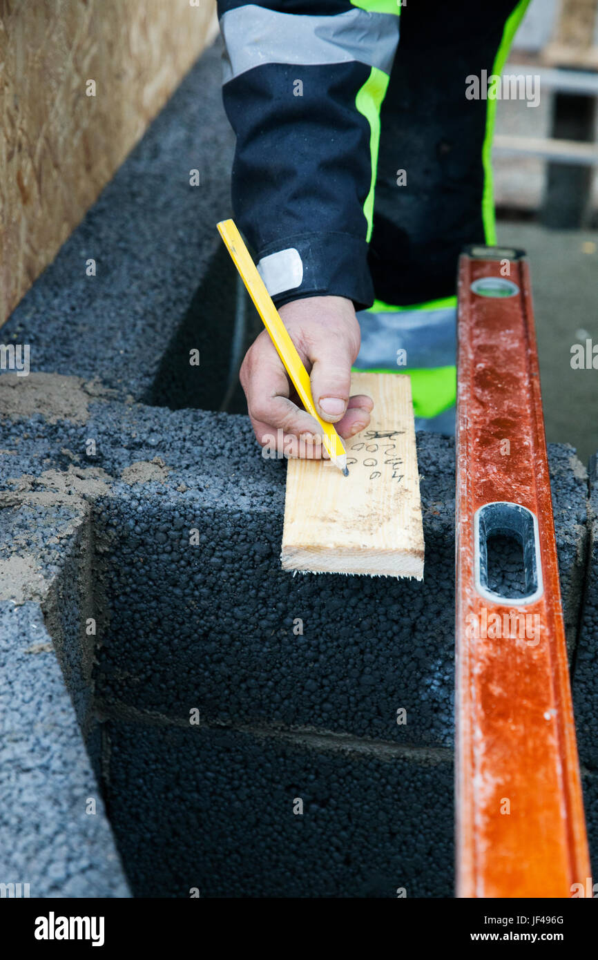 Man writing on plank Stock Photo - Alamy
