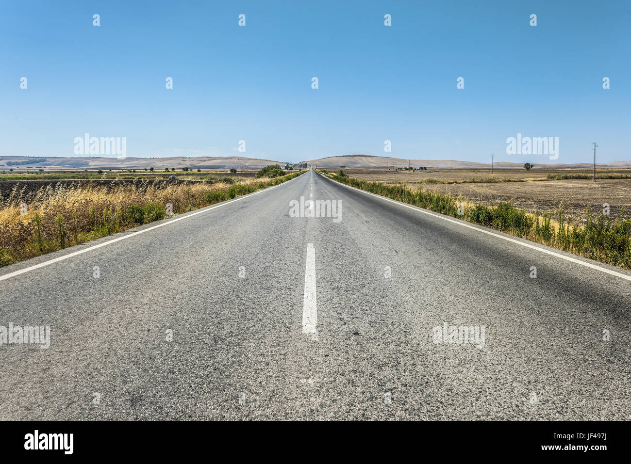Long asphalt road Stock Photo - Alamy