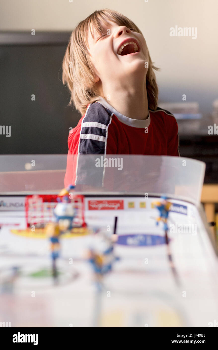 Boy playing table hi-res stock photography and images - Alamy