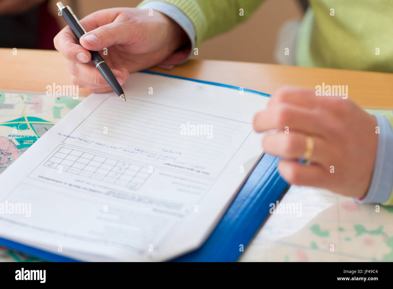 Man filling documents Stock Photo - Alamy