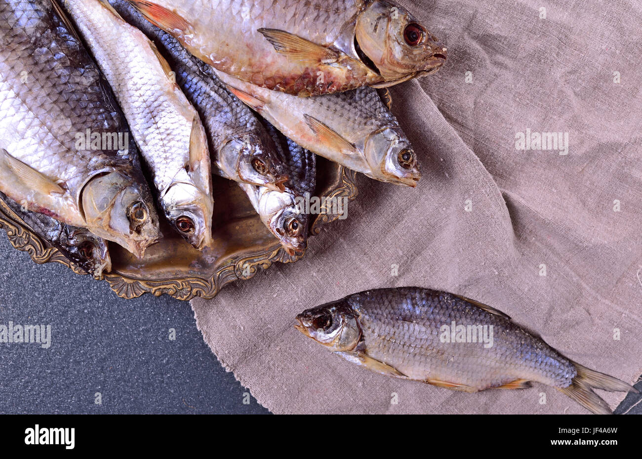 Cured fish carp on an iron plate, top view Stock Photo - Alamy