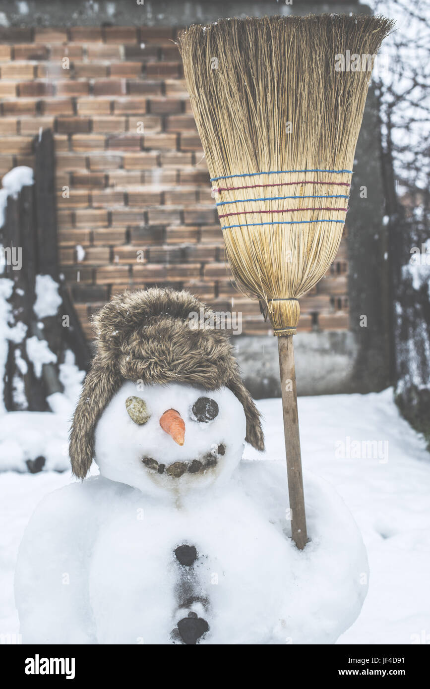 Snowman in the yard Stock Photo - Alamy