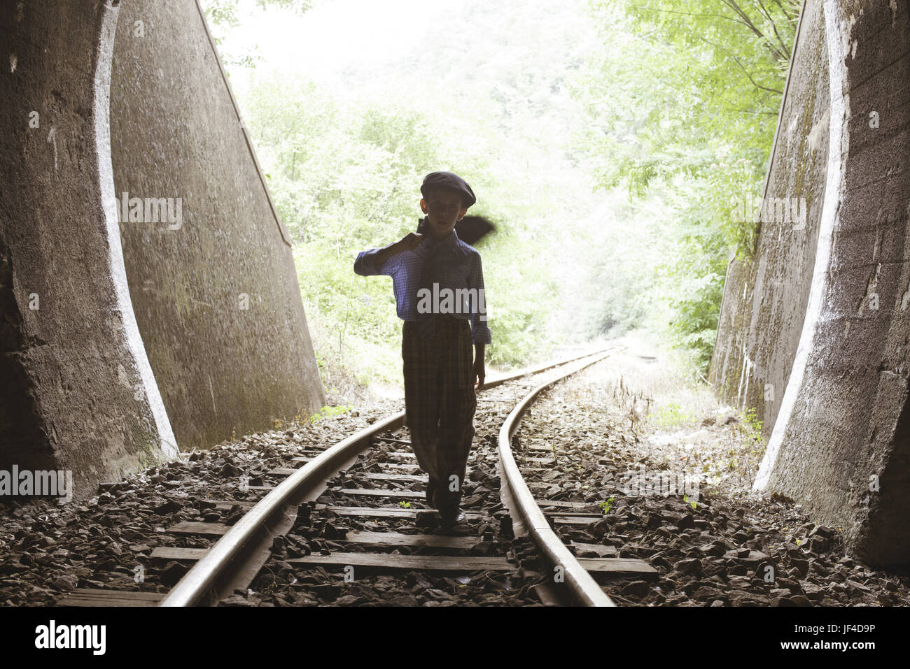 Child walking on railway road Stock Photo - Alamy