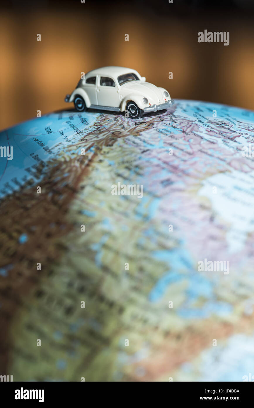 Car on globe Stock Photo - Alamy