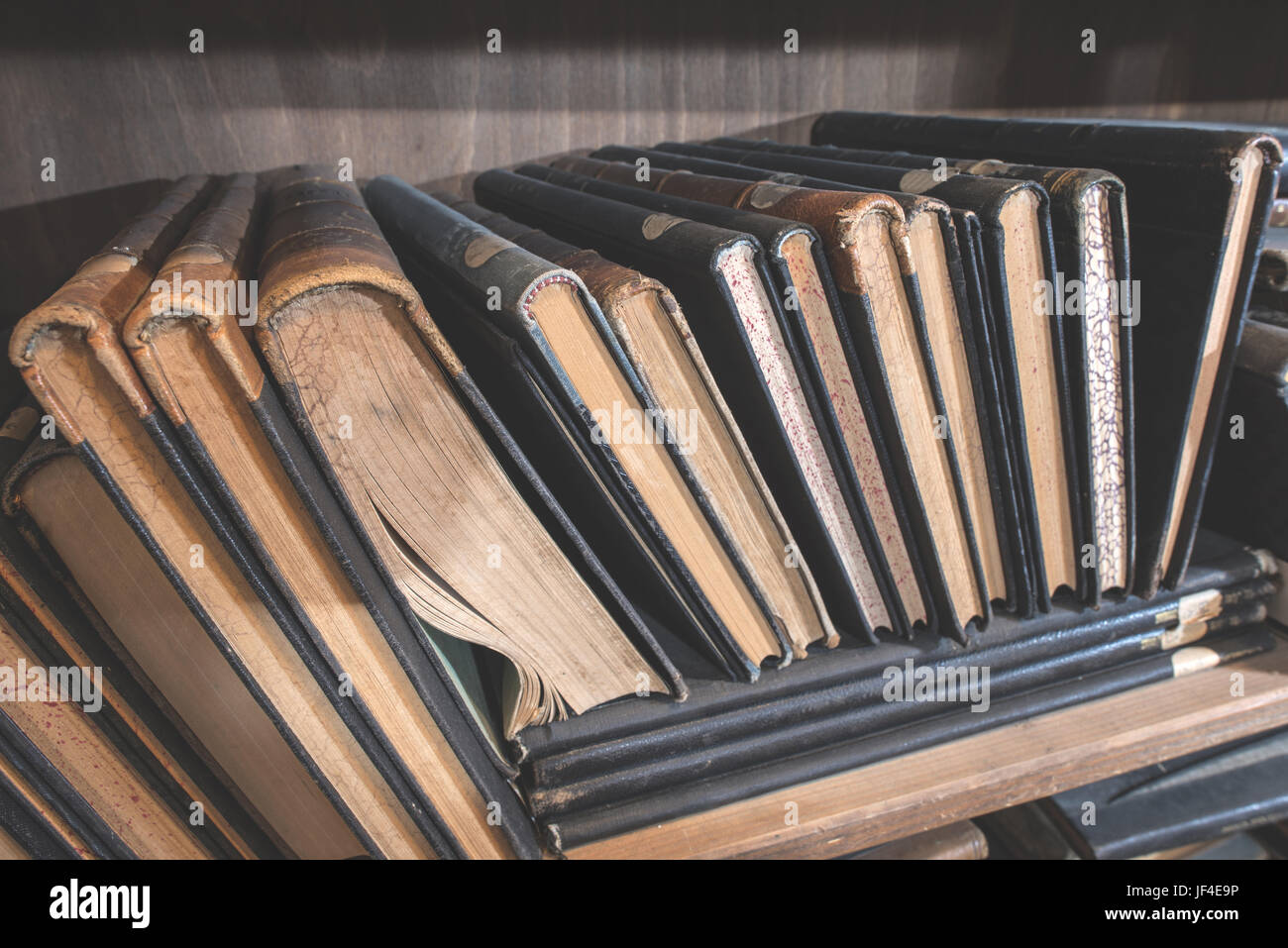 Old books in a vintage library Stock Photo - Alamy