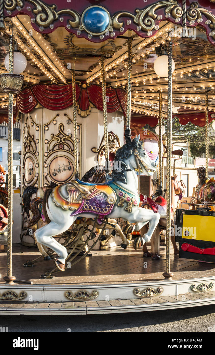 Carousel with horse in amusement park Stock Photo - Alamy