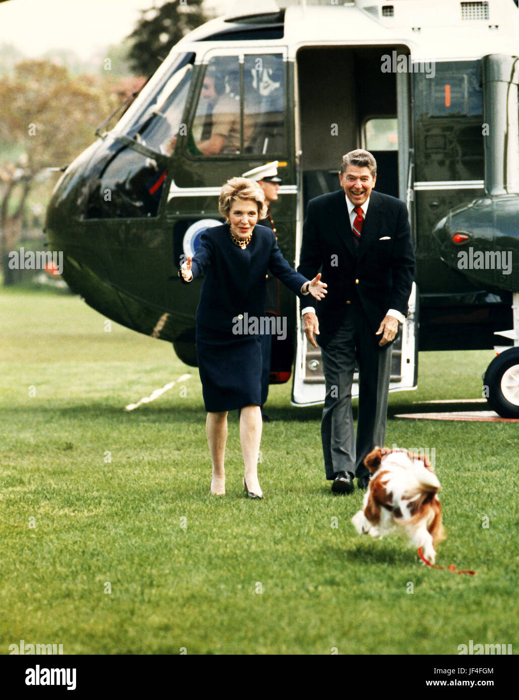 The Reagan's being greeted by their dog "Rex" after arriving at the ...