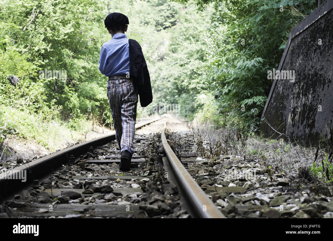 Child walking on railway Stock Photo - Alamy