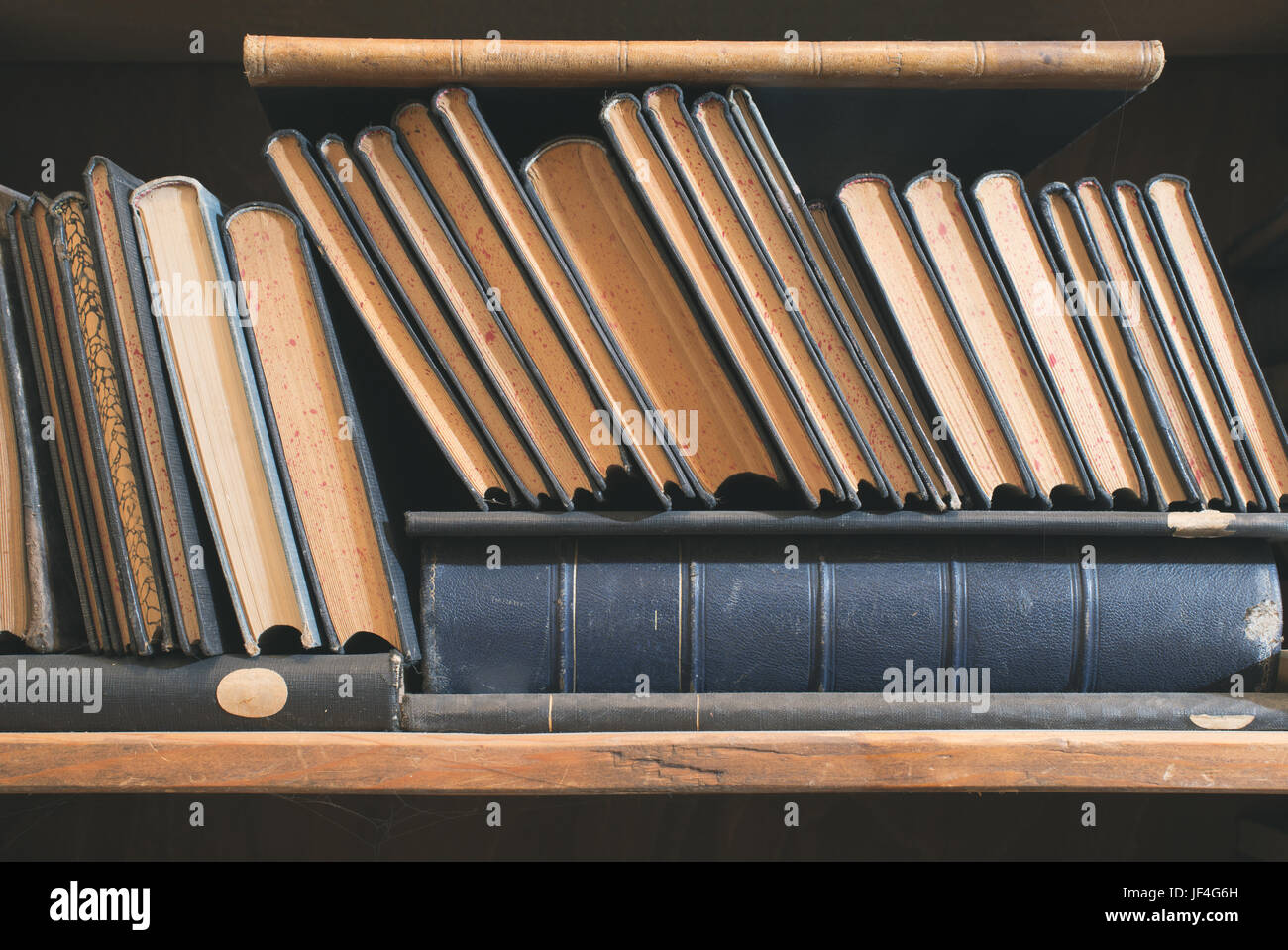 Old books in a vintage library Stock Photo - Alamy