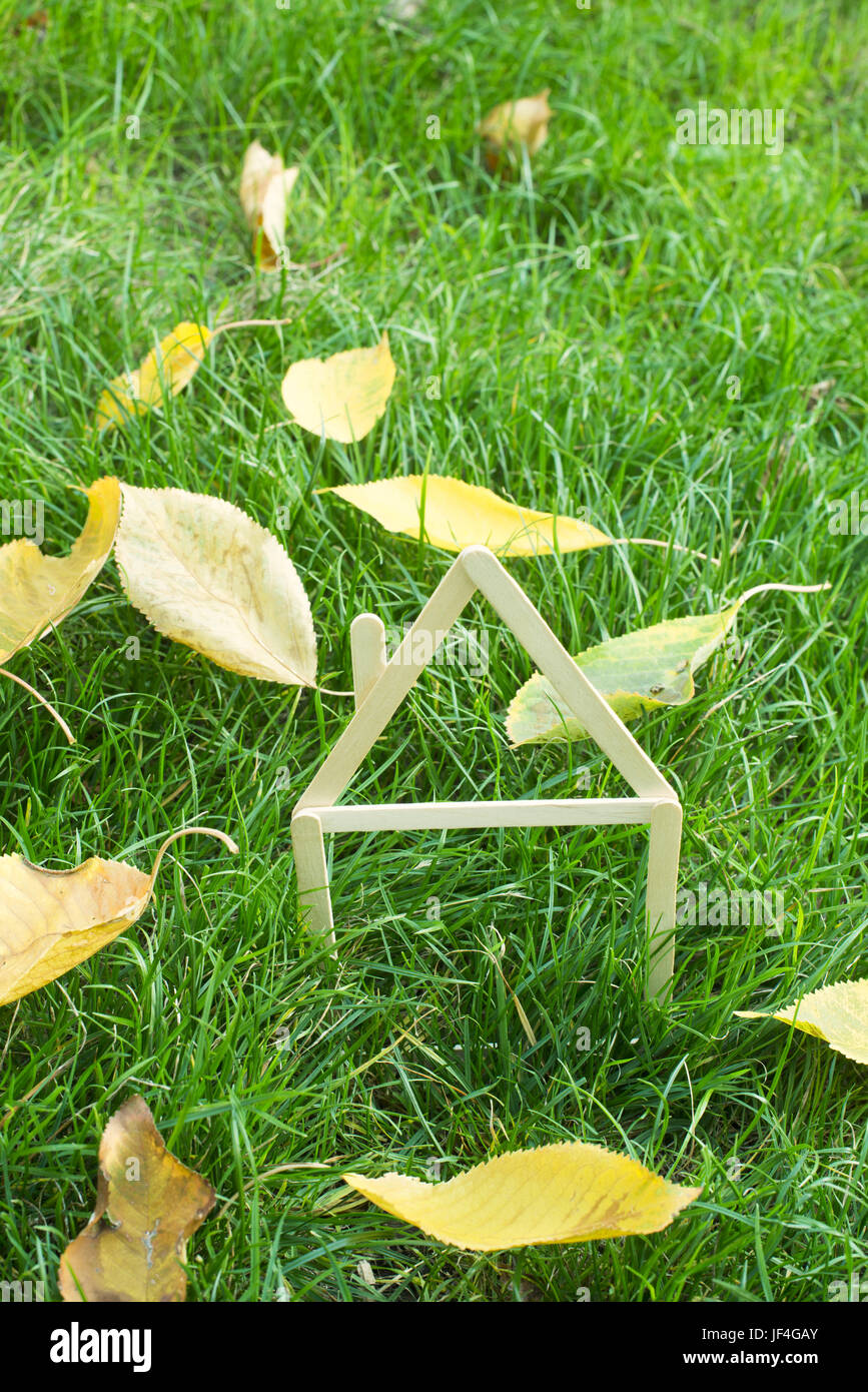 Model house made on green grass Stock Photo - Alamy