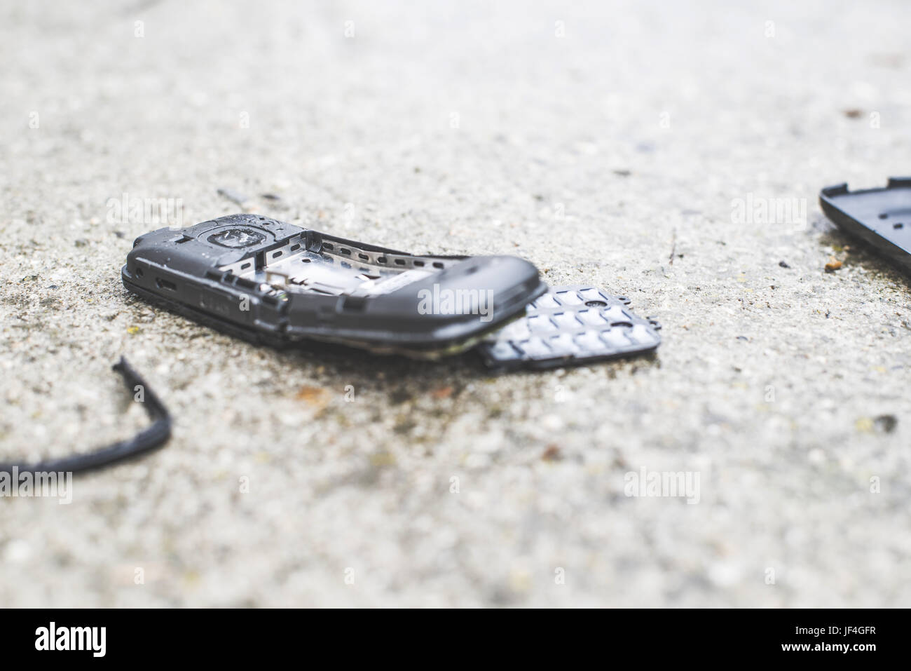 Old broken mobile phone Stock Photo - Alamy