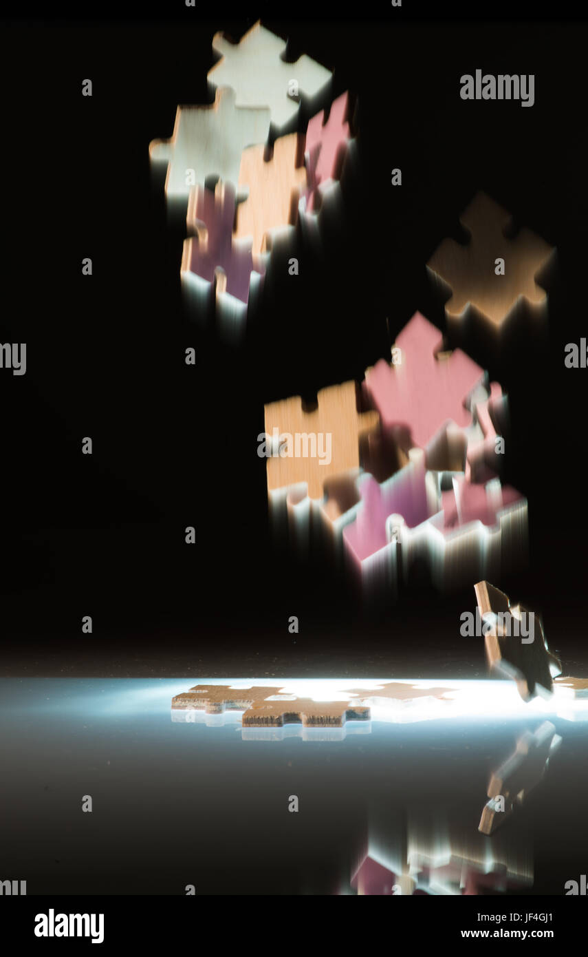 Falling puzzle pieces hi-res stock photography and images - Alamy