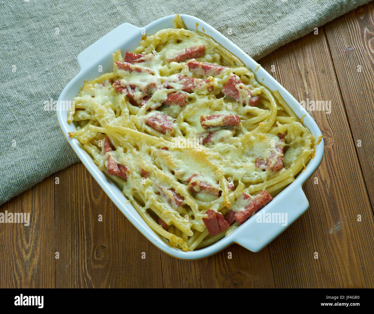 Italian baked pasta with salami Stock Photo - Alamy