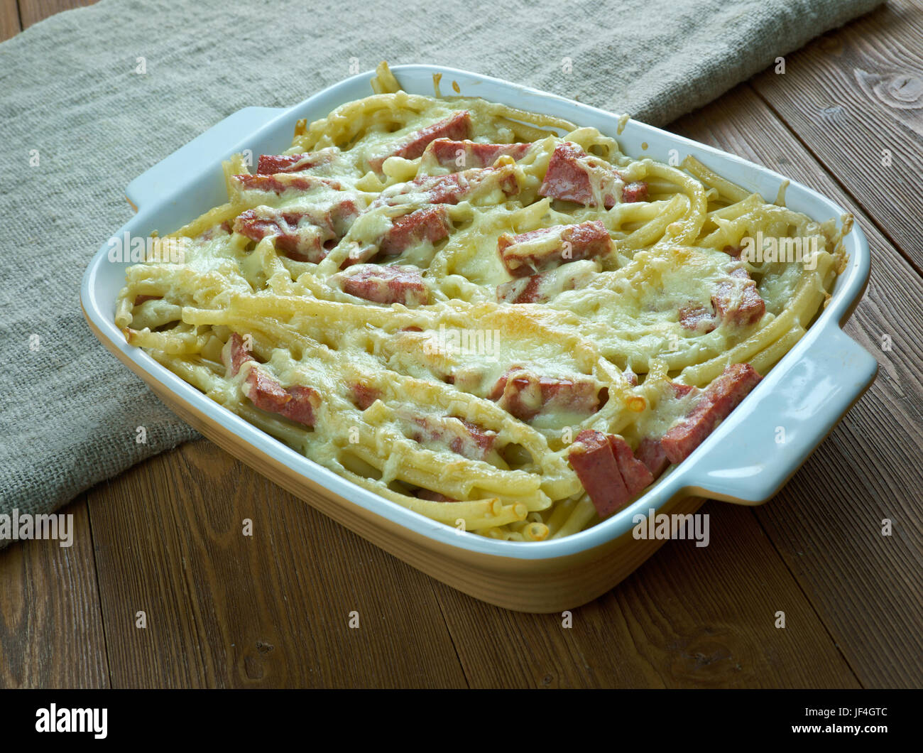 Italian baked pasta with salami Stock Photo - Alamy