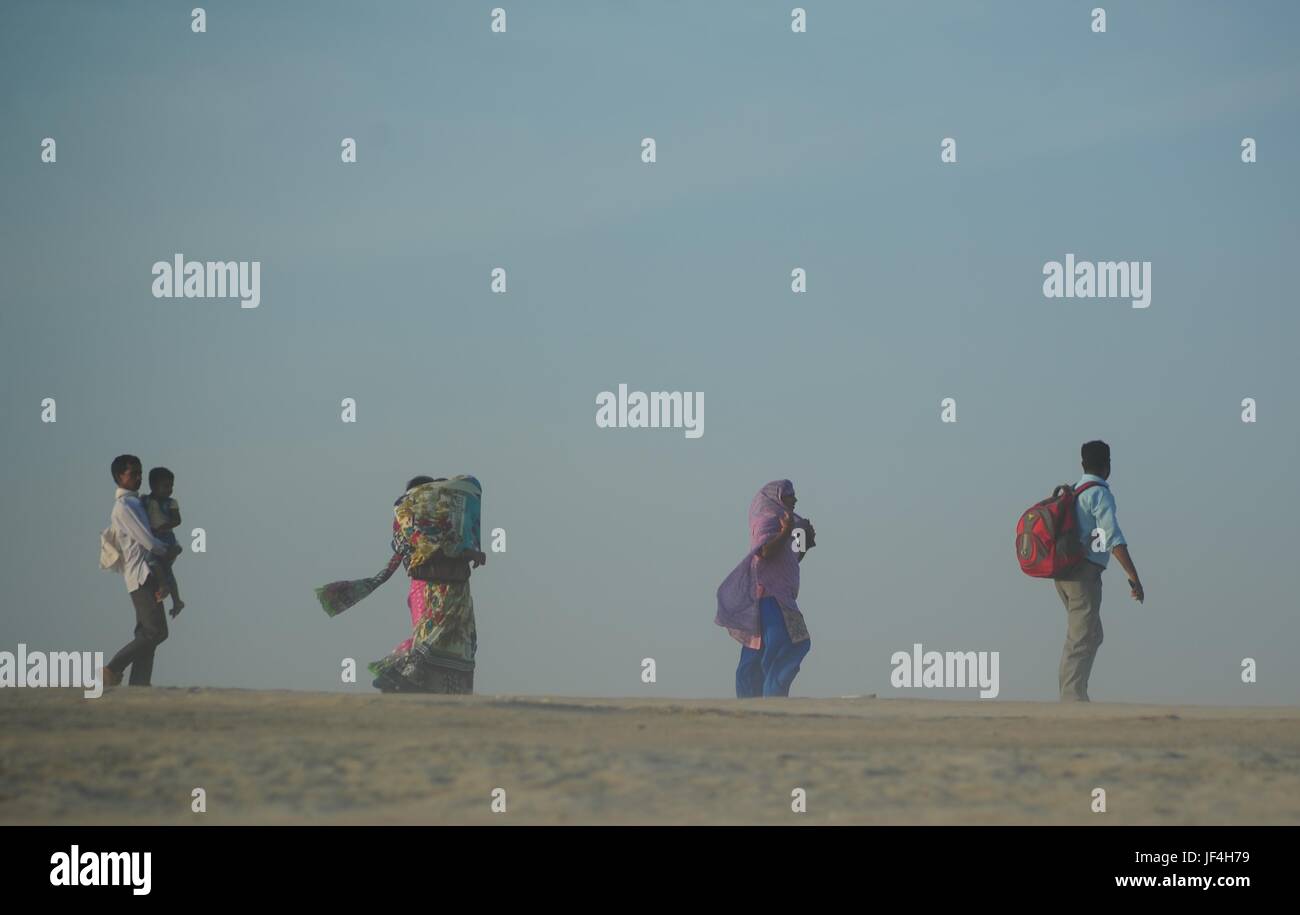 Allahabad, India. 28th June, 2017. Pilgrims walks trough dust storm at ...