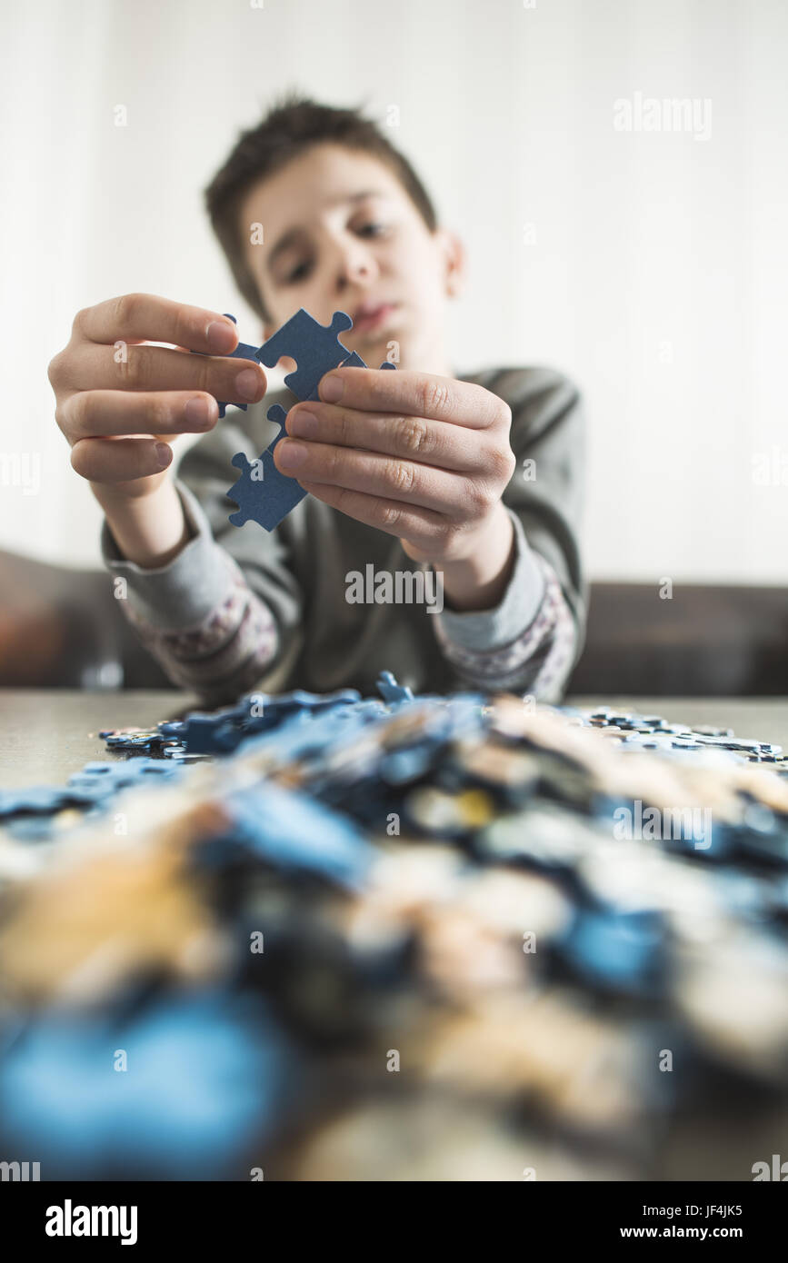 Child and puzzle Stock Photo - Alamy