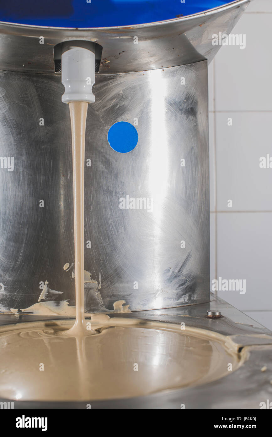 Machine mixing chocolate Stock Photo - Alamy